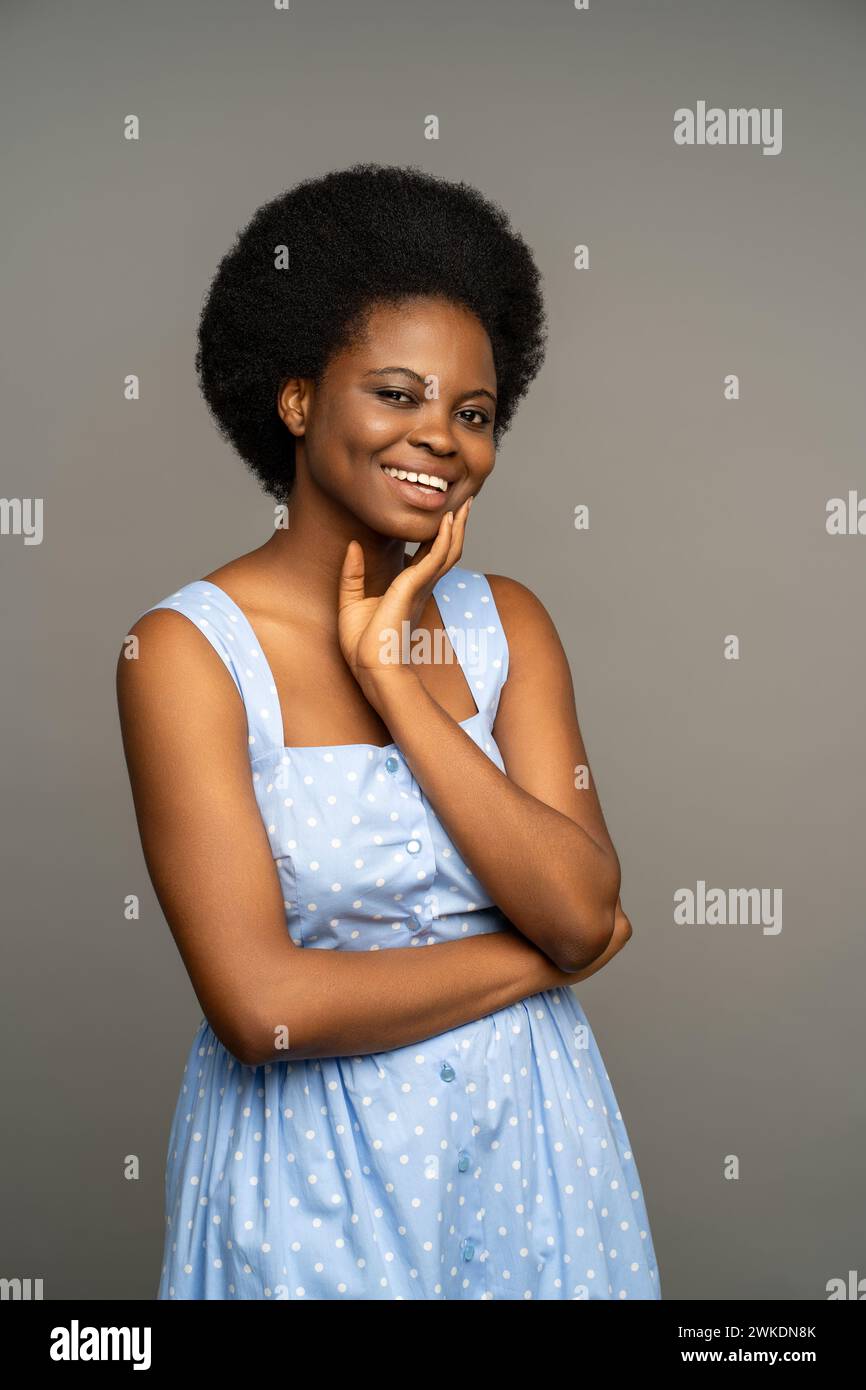 Cheerful african american female with romantic smile, cute cheek ...