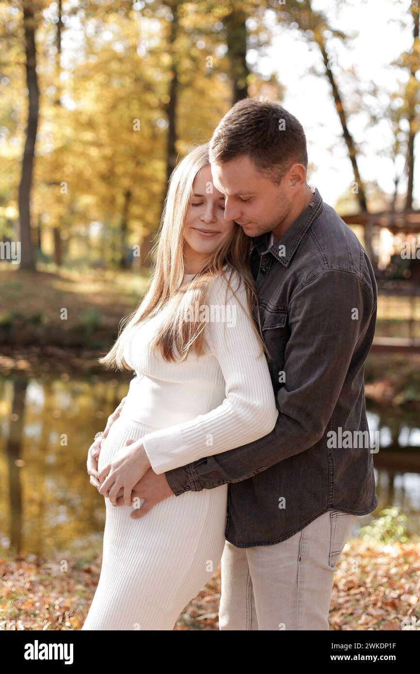 Family day. Stylish marriage pregnant couple waiting for baby. Man is ...
