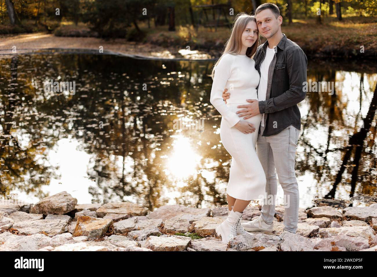 Family day. Stylish marriage pregnant couple waiting for baby. Man is ...
