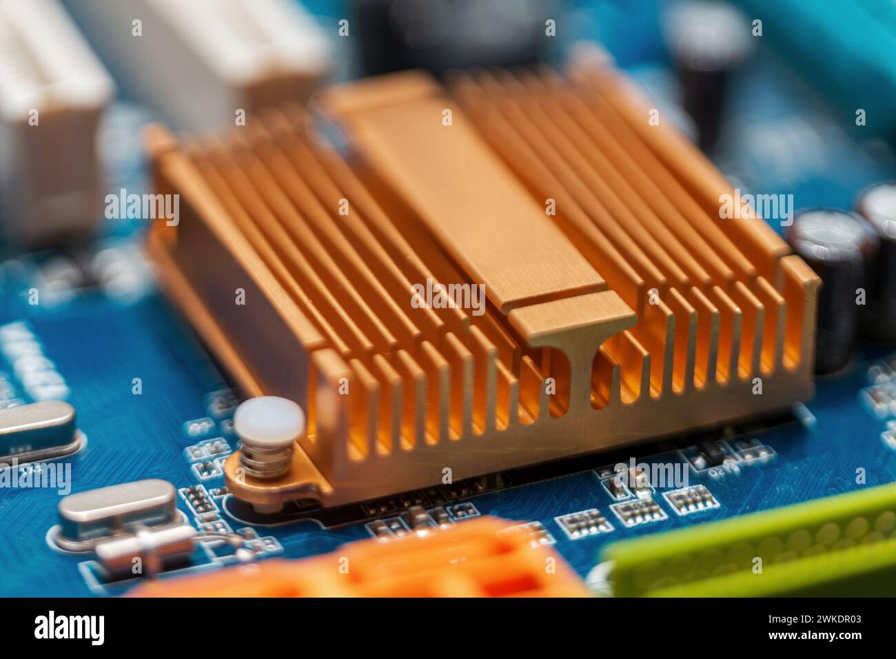 Computer hardware with a chip, transistor and cooling, close-up ...