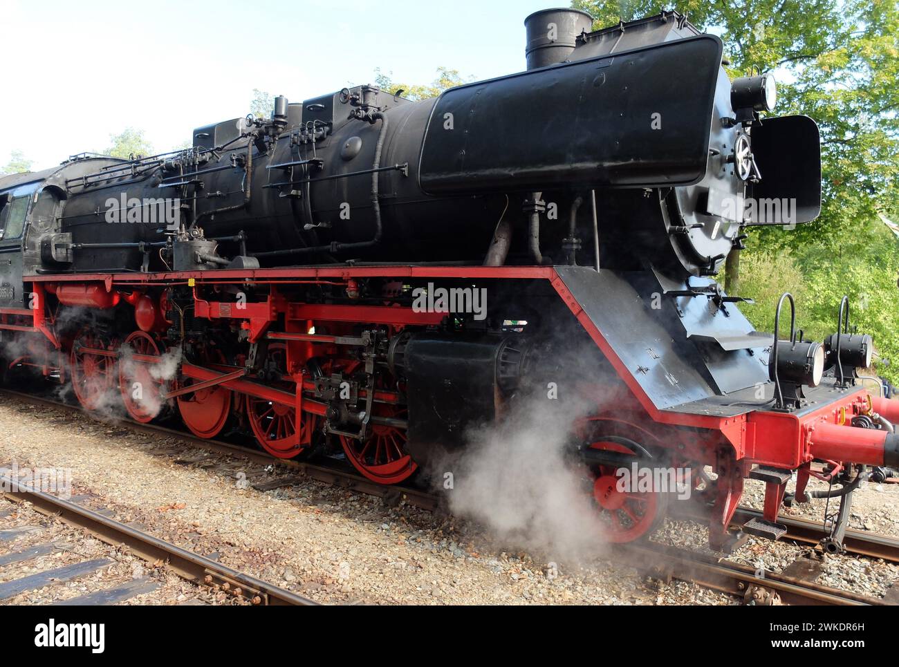 An impressive old black and red steam locomotive from Germany is ...