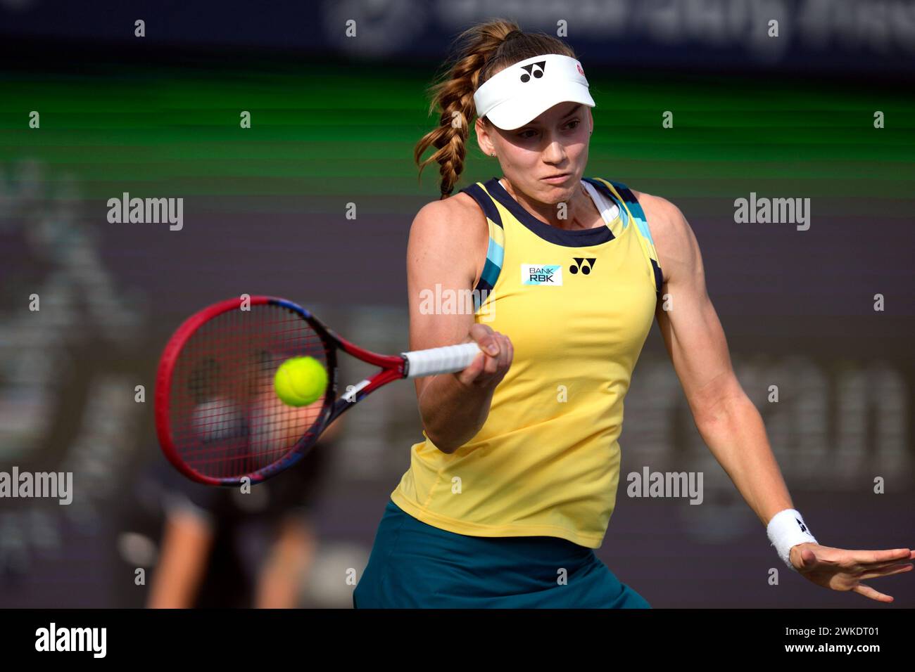 Elena Rybakina of Kazakhstan returns the ball to Victoria Azarenka ...