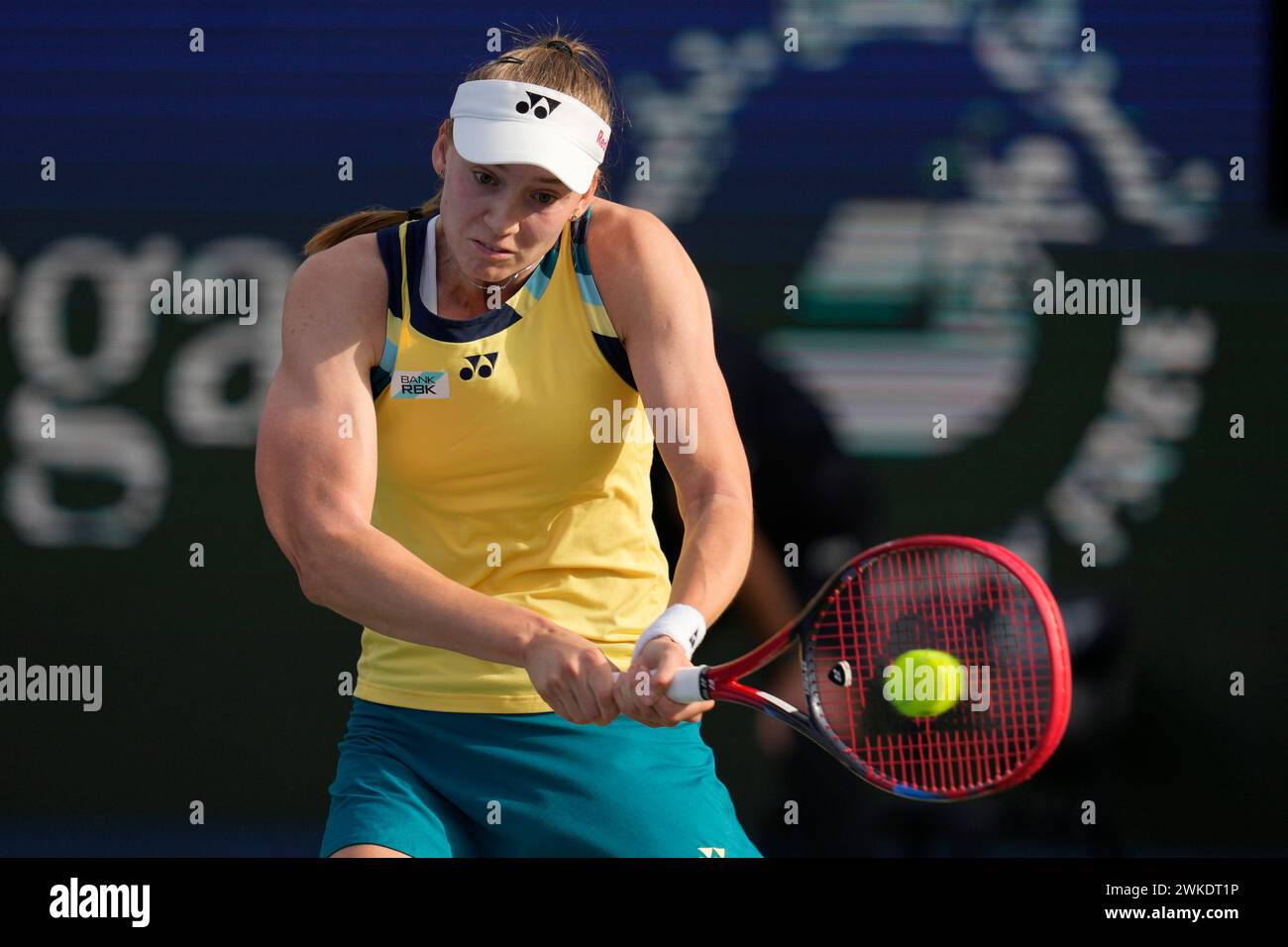 Elena Rybakina of Kazakhstan returns the ball to Victoria Azarenka ...