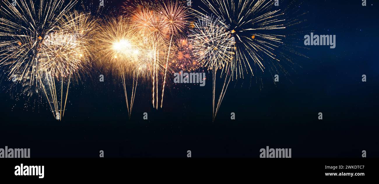 Amazing golden fireworks exploding in the starry night sky, concept ...