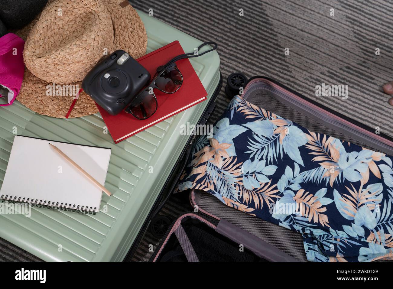 View from above of an open suitcase full of clothes ready to travel ...