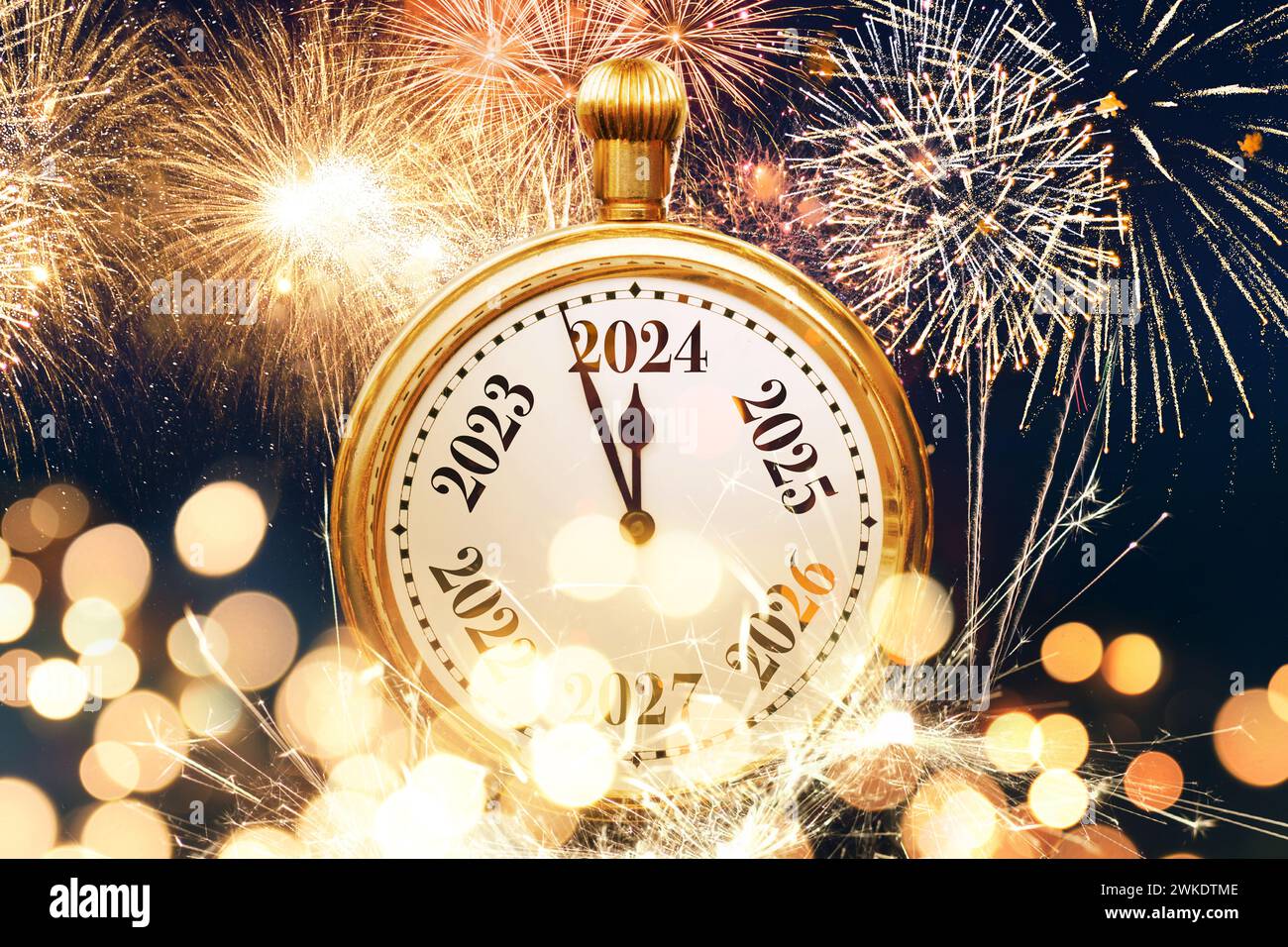Vintage golden clock points to 2024 new year with lights bokeh and fireworks. New Year card ...