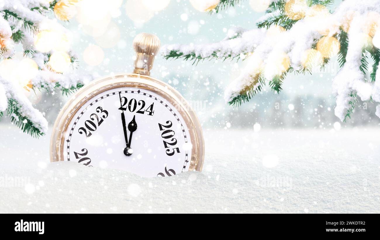 Vintage clock in the snow and points to the new year 2024. Beautiful ...