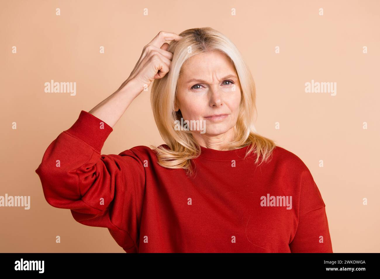 Photo of suspicious unsure lady dressed red pullover finger head afraid ...