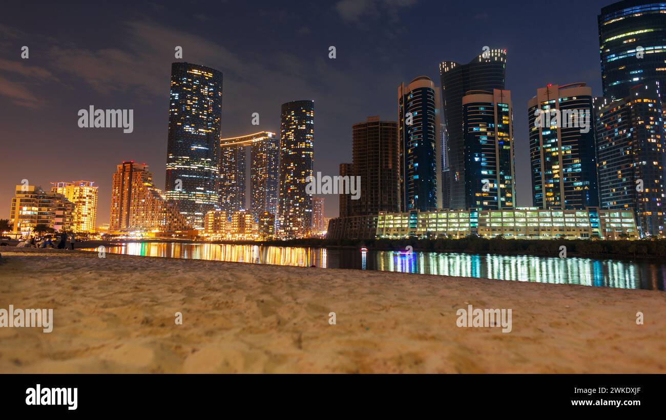 Beautiful night beach with metropolis and buildings in the city of Abu ...