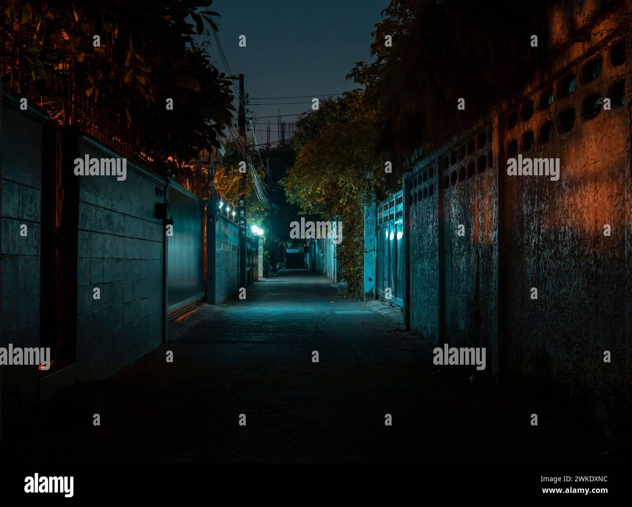 long narrow street at night in the city Stock Photo - Alamy