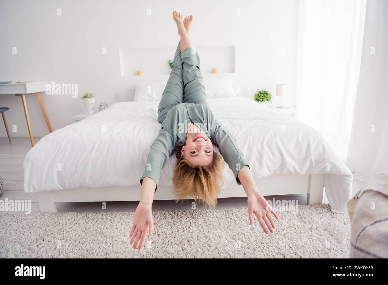 Full body photo of charming carefree blonde girl laying on bed wearing ...