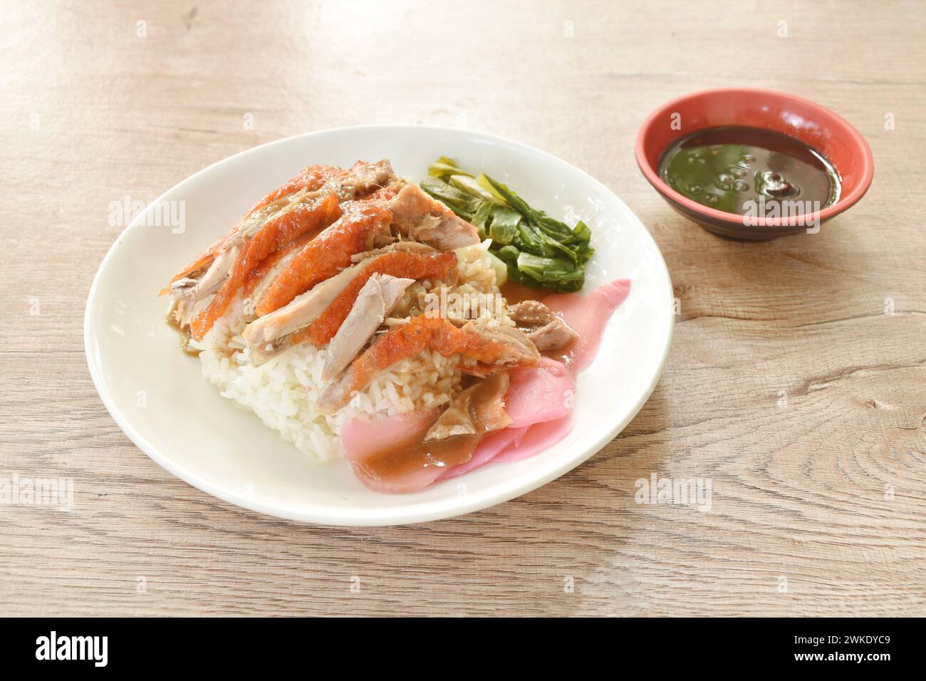 slice roasted duck topping rice with pink pickled ginger and boiled ...