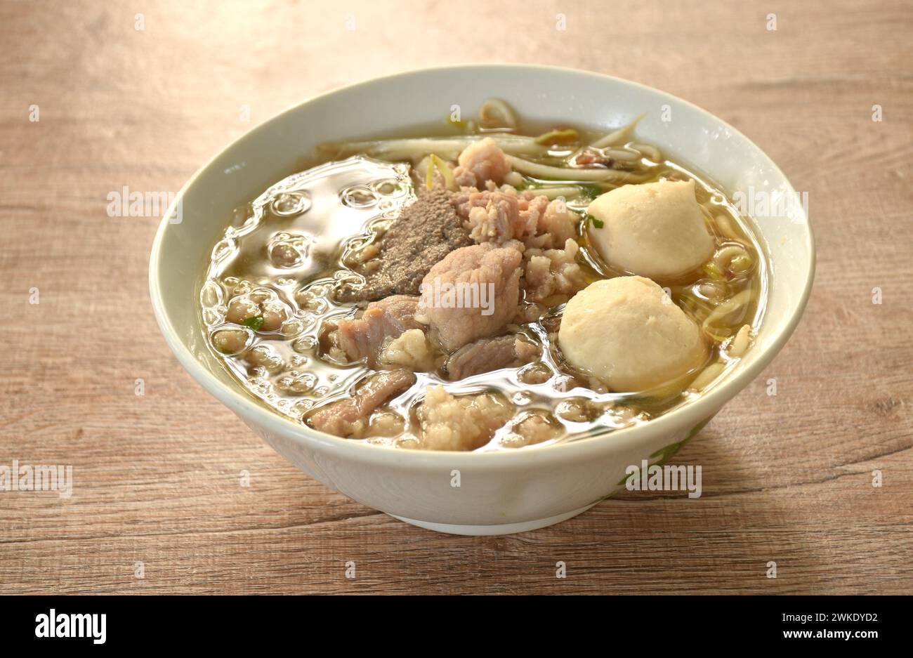 boiled slice soft and chop pork and meatball in clear soup on bowl ... boiled slice soft and chop pork and meatball in clear soup on bowl ...