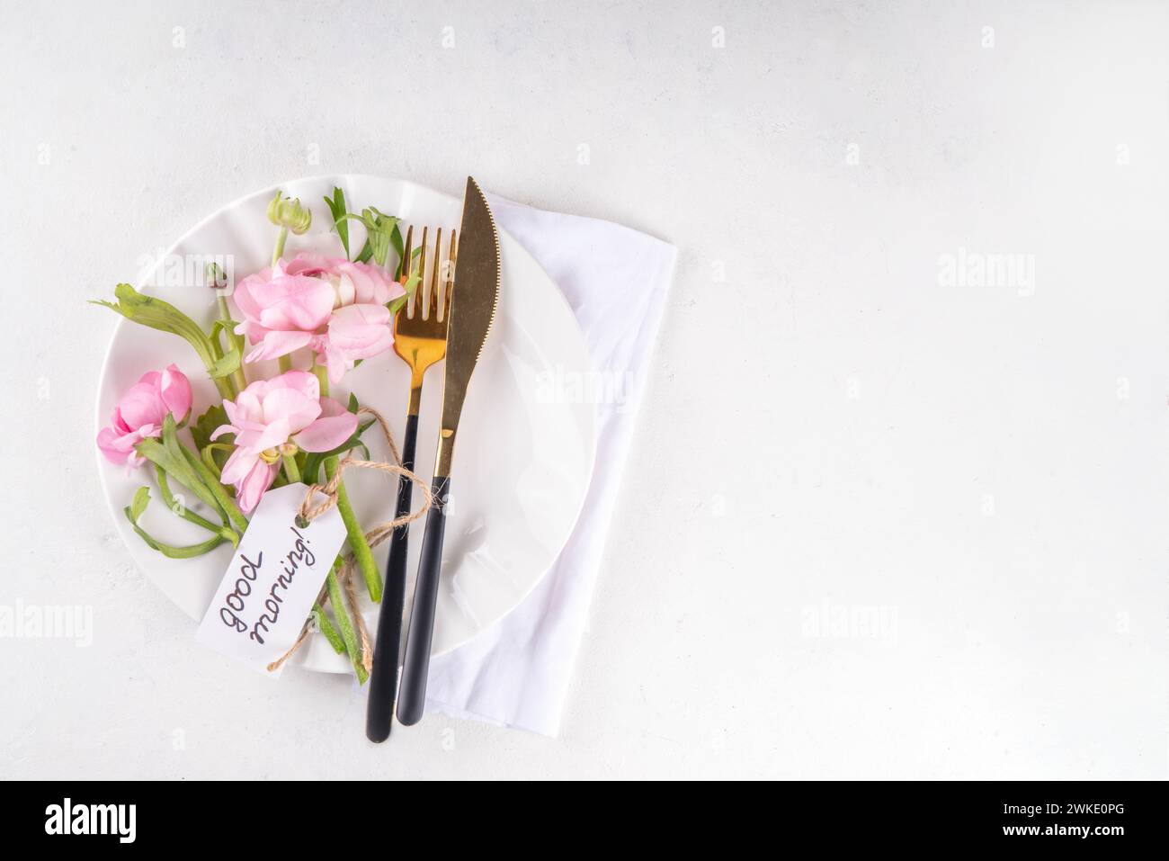 Spring holiday table setting with tender cute rose pink flowers ...