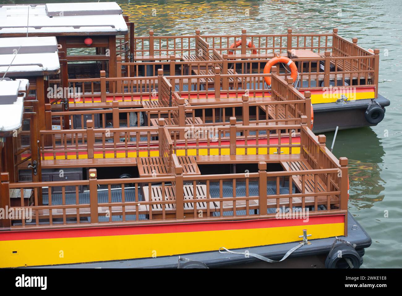 Close up of the stationary commercial cruise bumboats dock along ...