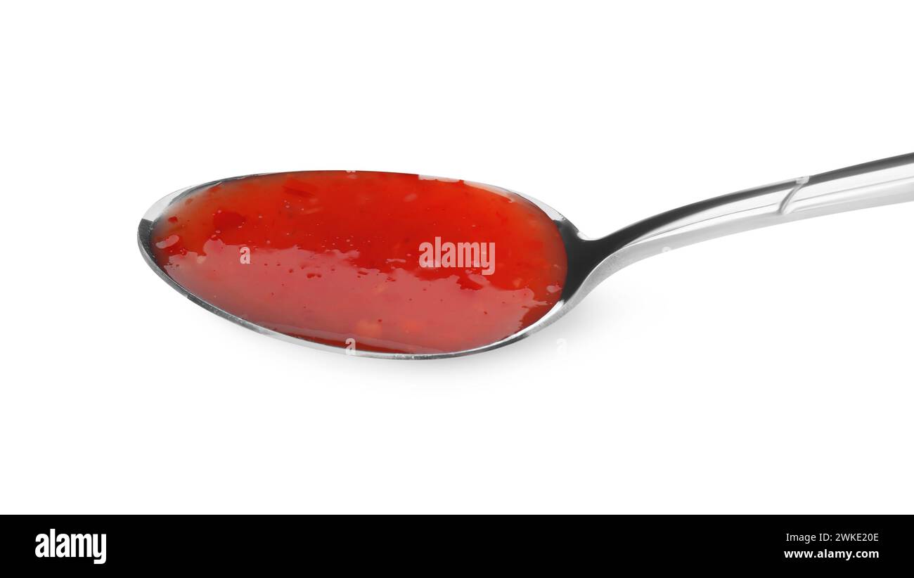 Spicy chili sauce in spoon isolated on white Stock Photo - Alamy