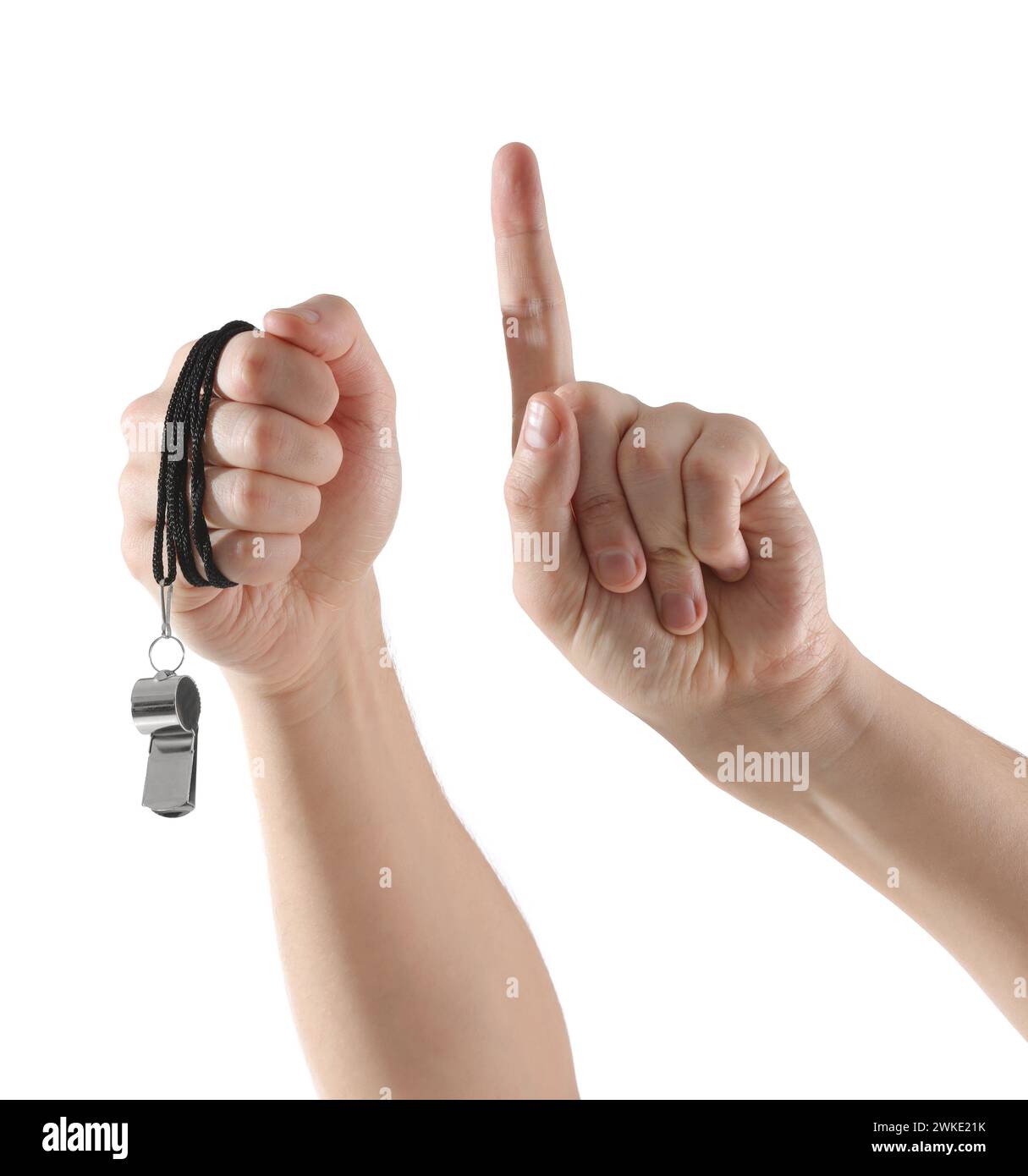 Referee holding whistle and pointing on white background, closeup Stock ...