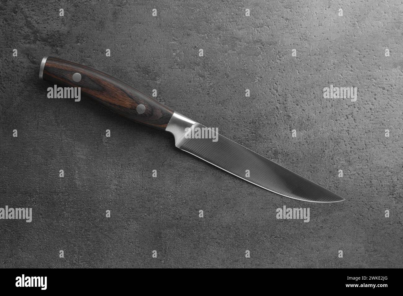 One knife on grey textured table, top view Stock Photo - Alamy
