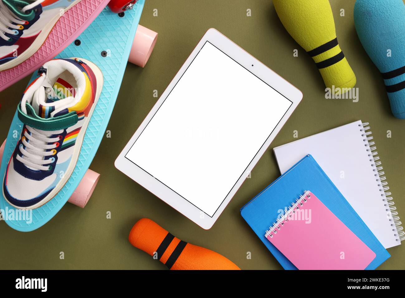 Flat lay composition with modern tablet on olive background. Space for ...