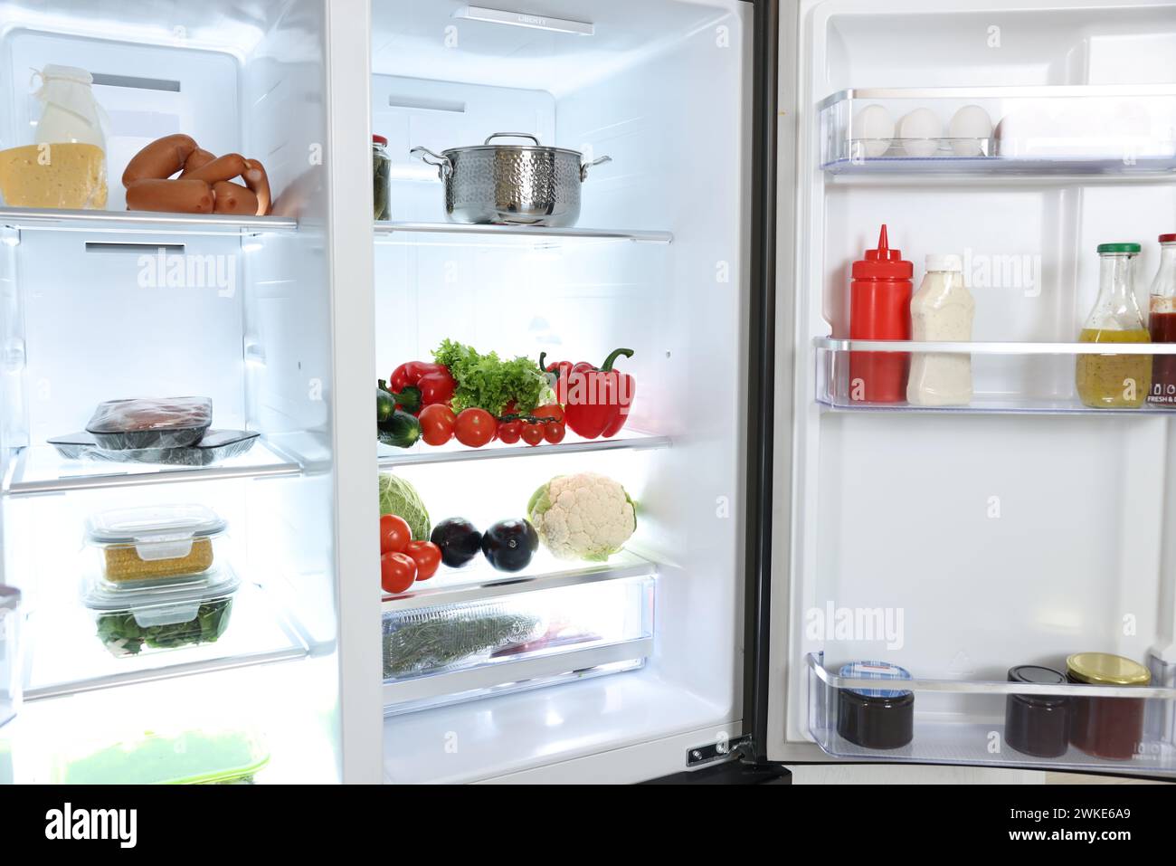 Modern open refrigerator full of different products Stock Photo - Alamy