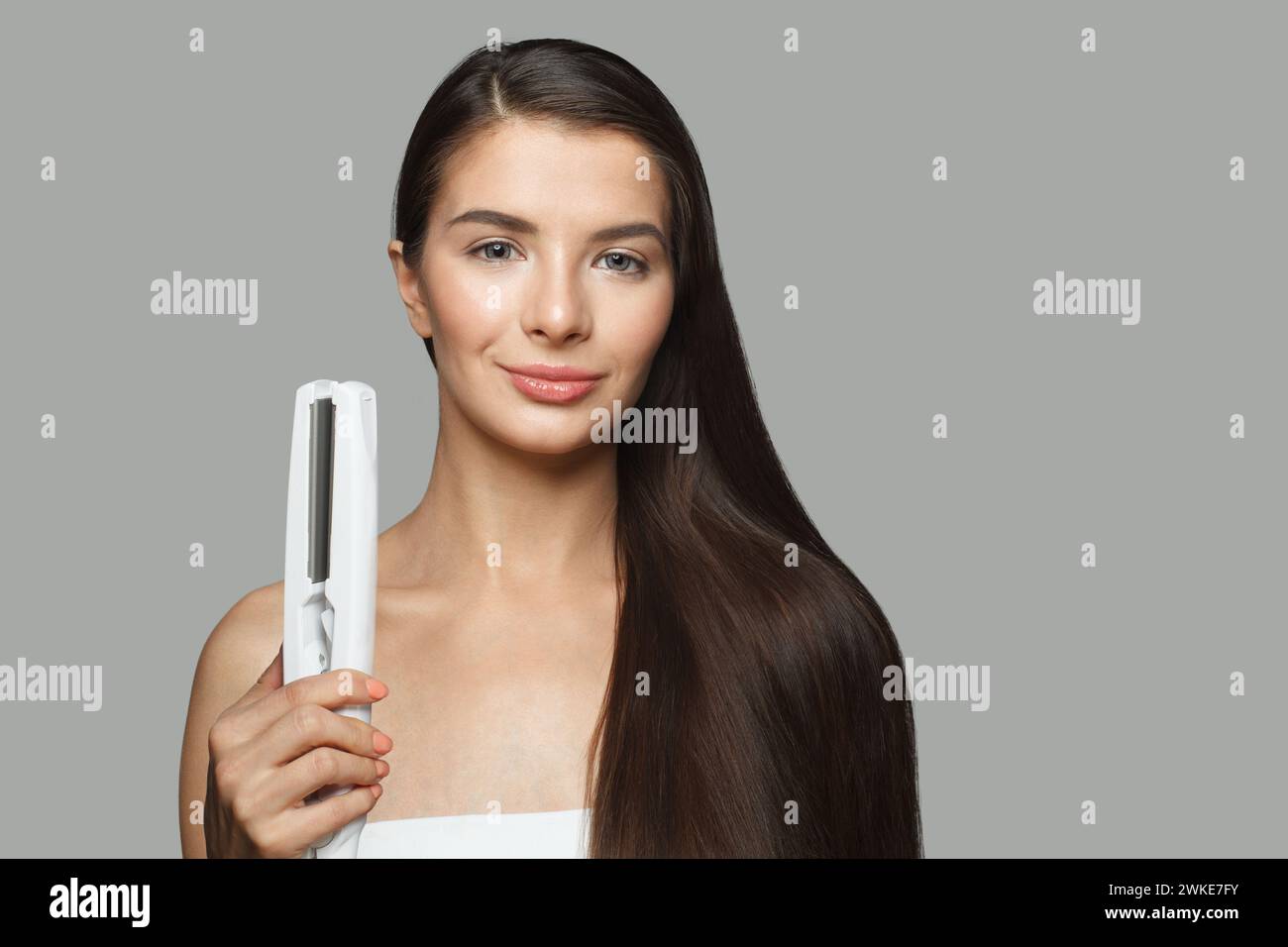 Straightening irons woman hi-res stock photography and images - Alamy