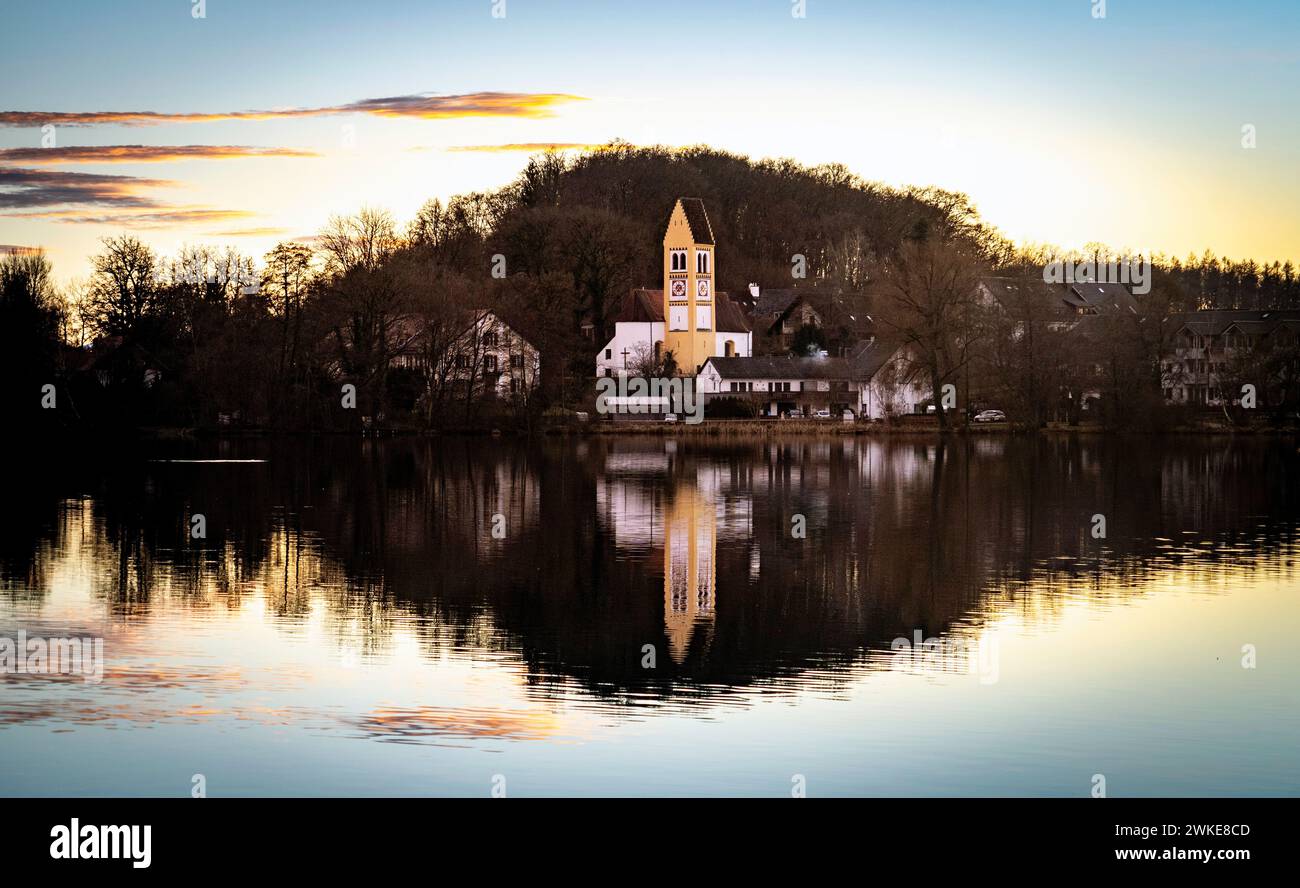 The lake Weßling, Bavaria, and its church at sunset on the last day of ...