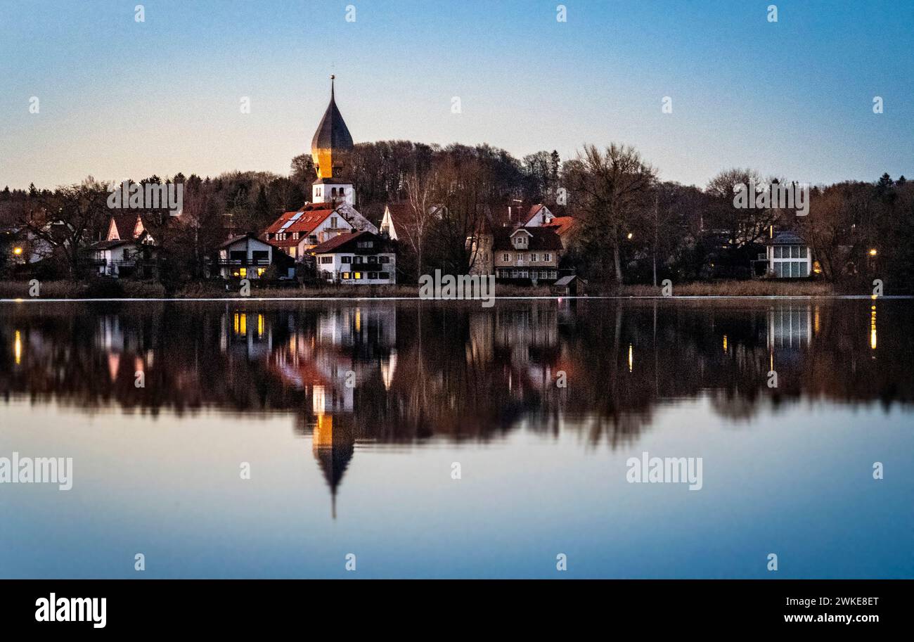 The lake Weßling, Bavaria, and its church at sunset on the last day of ...