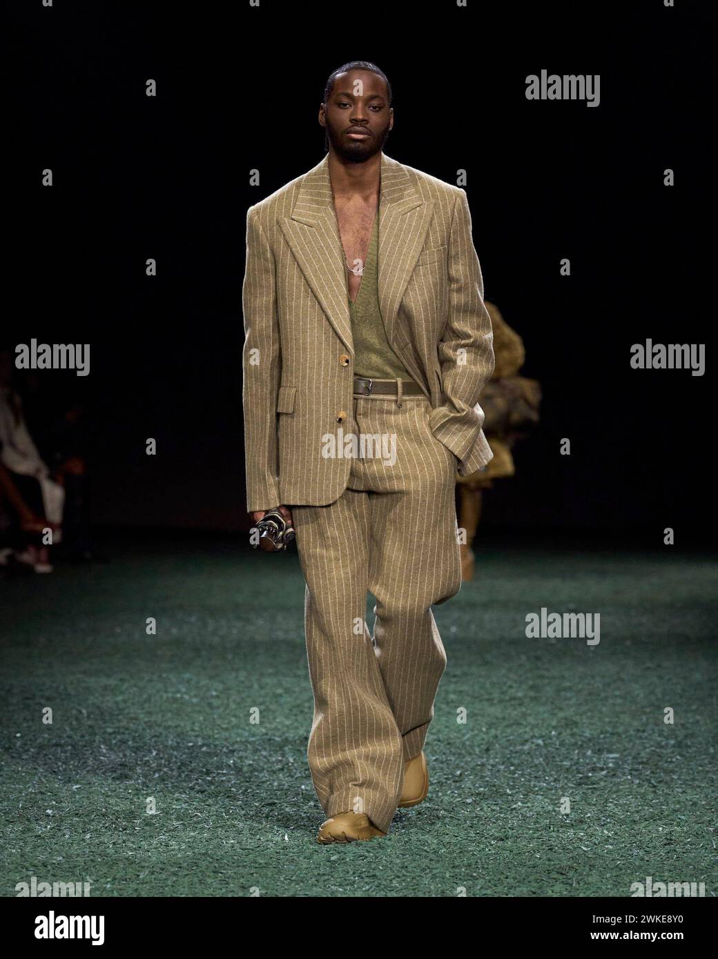 IMAGE DISTRIBUTED FOR BURBERRY - Model Malachi wears a design created ...