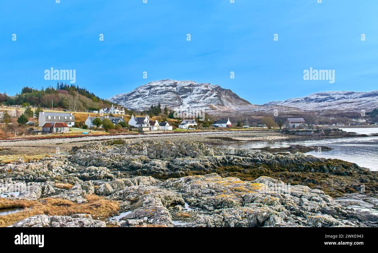 Ardarroch village houses and the rocky shoreline of Loch Kishorn Stock ...