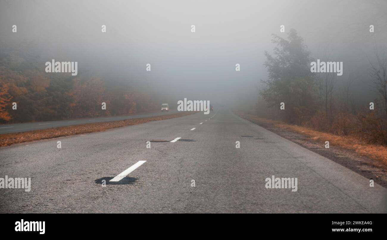 Journey through fog covered dark hi-res stock photography and images ...