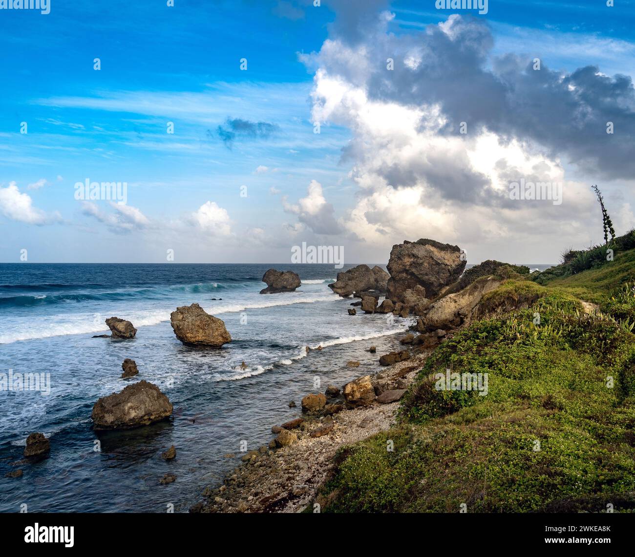 The coast of Bathsheba, Barbados, on a sunny day, with scenic clouds ...