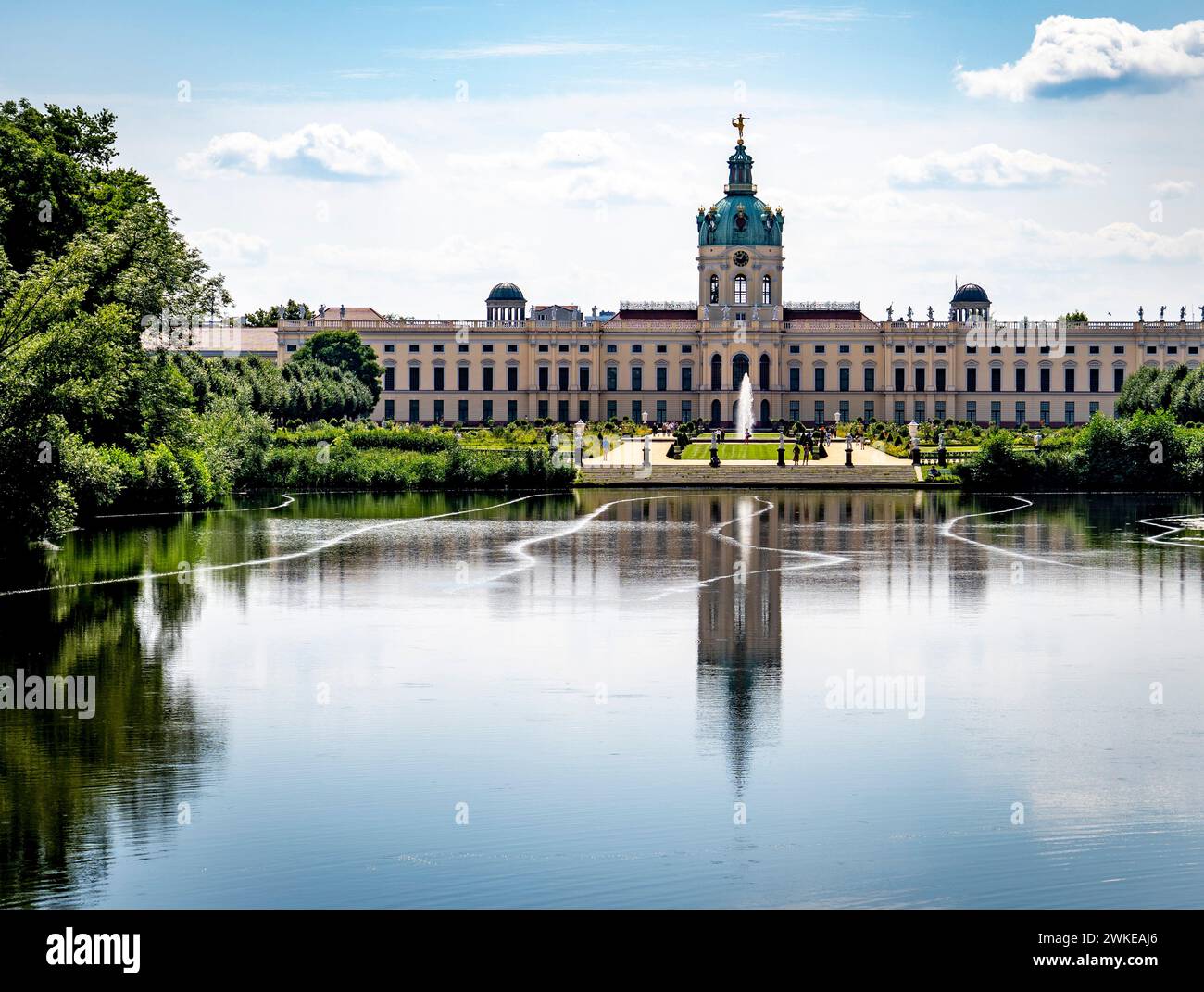 The castle and the lake of Charlottenburg in Berlin on a sunny day ...