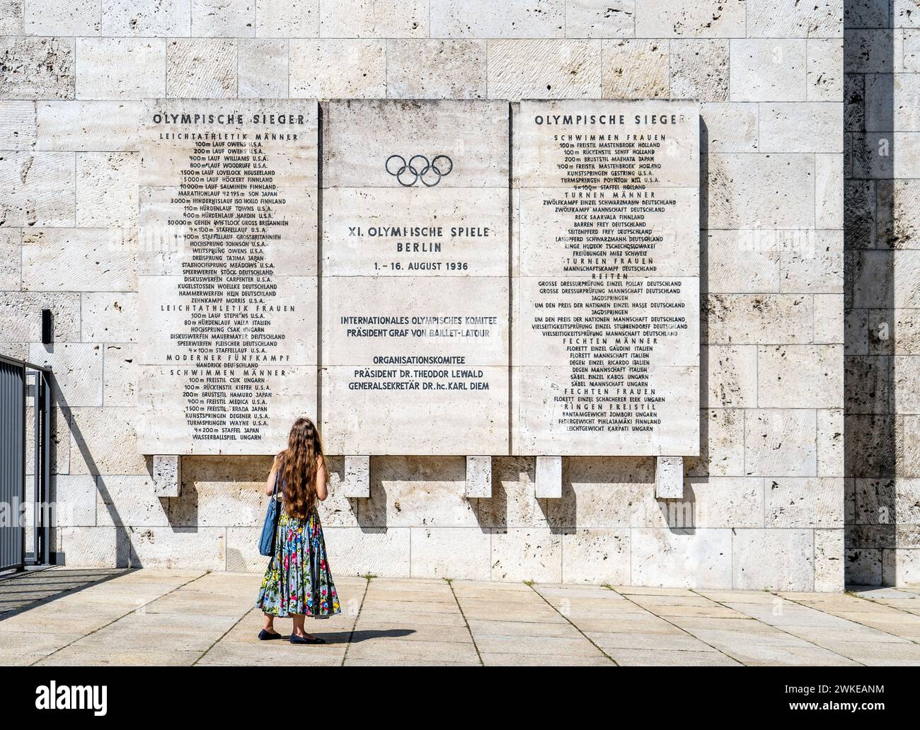A german gilr reads the inscriptions remembering the Olympic games of ...
