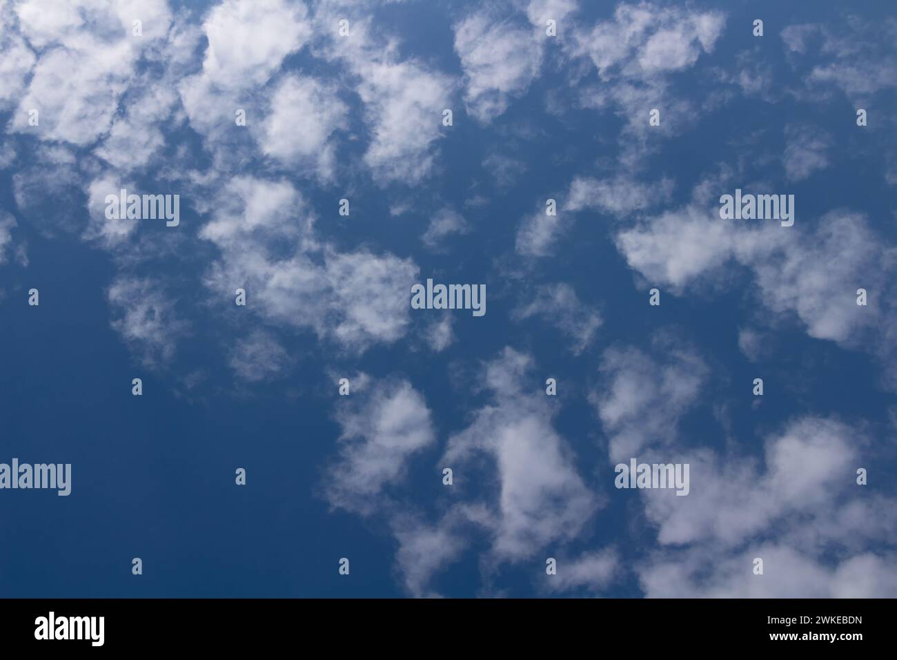 Little white clouds in the blue sky. Weather formation Stock Photo - Alamy
