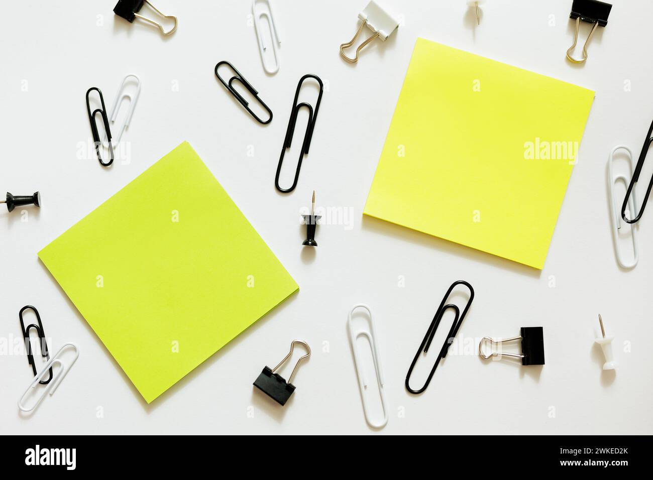 two sticky notes and paperclips over white background Stock Photo - Alamy