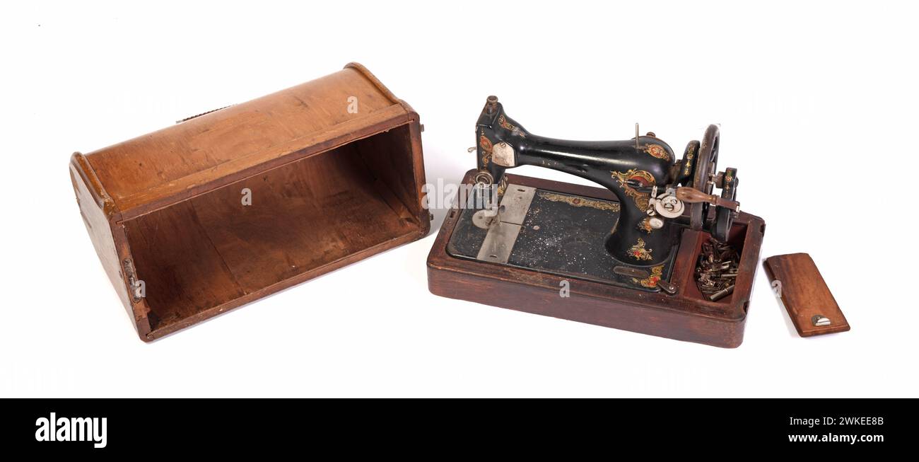 Broken old sewing machine, isolated on white background Stock Photo - Alamy