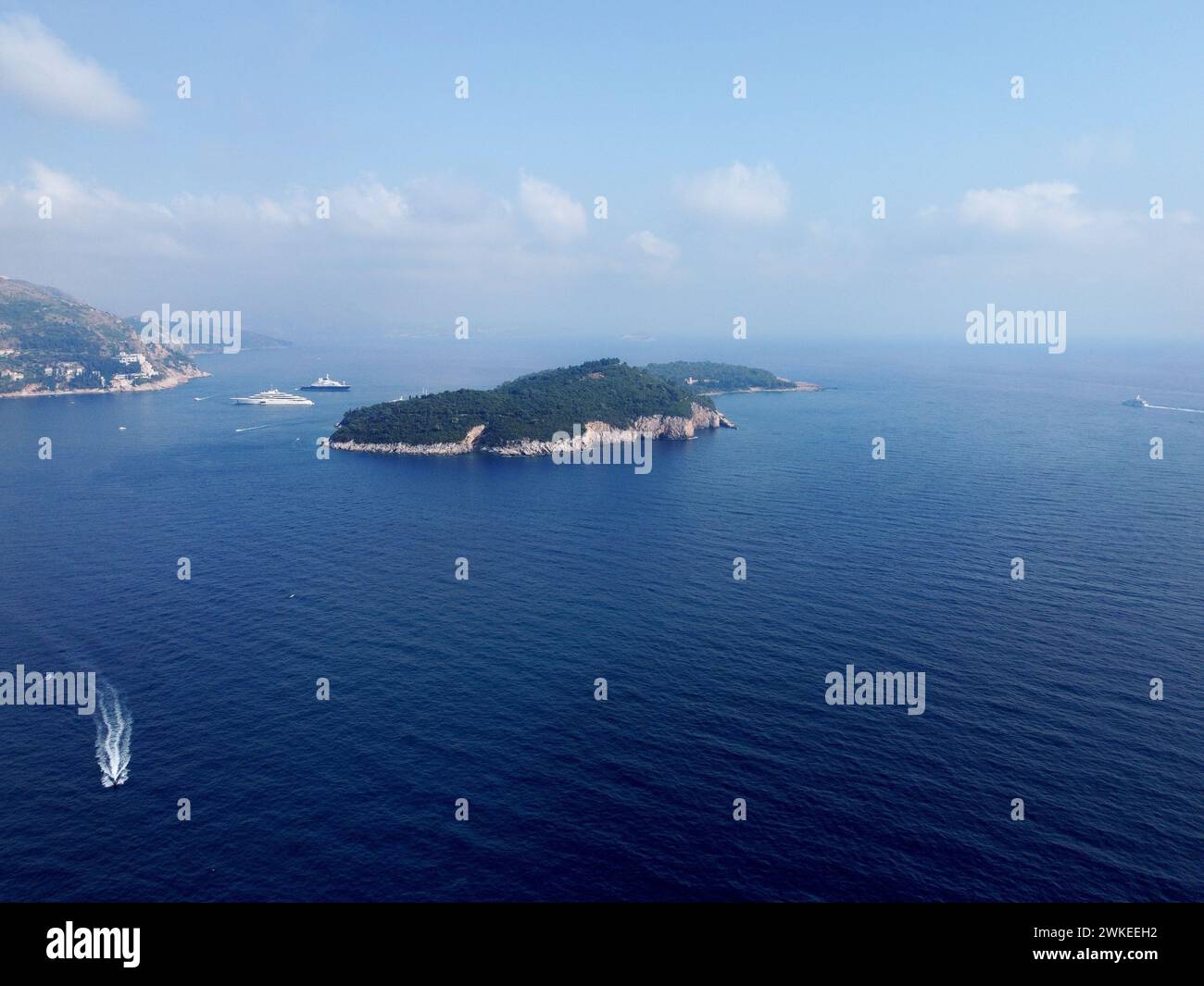 aerial view of small wild rocky island aerial top down view, coral reef ...