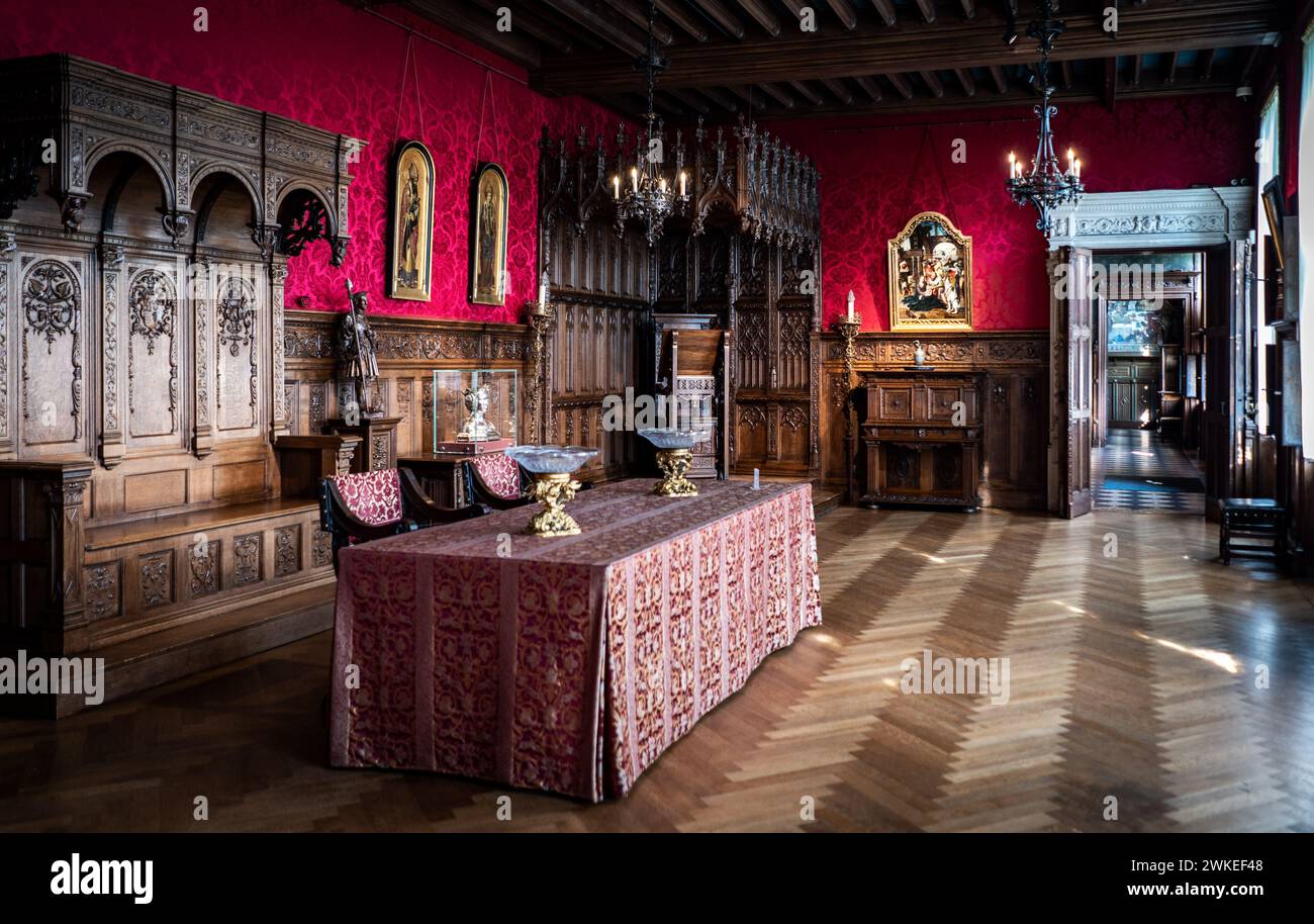 The elegant dining hall of a Belgian castle with wooden parquet and ...