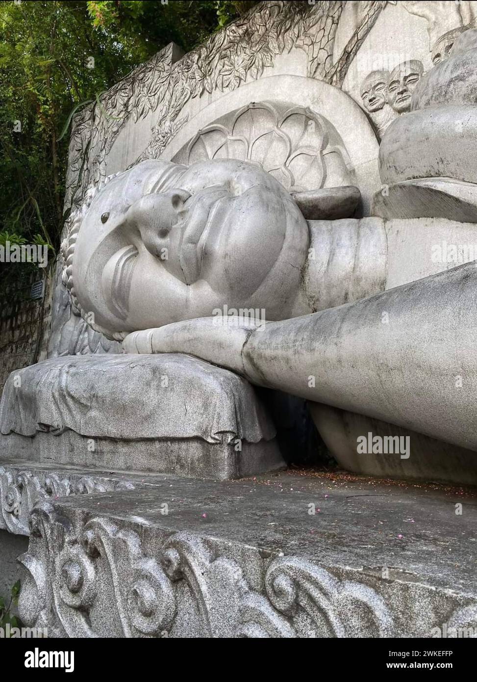 Sleeping buddha statue in the park at phuket, thailand Stock Photo - Alamy