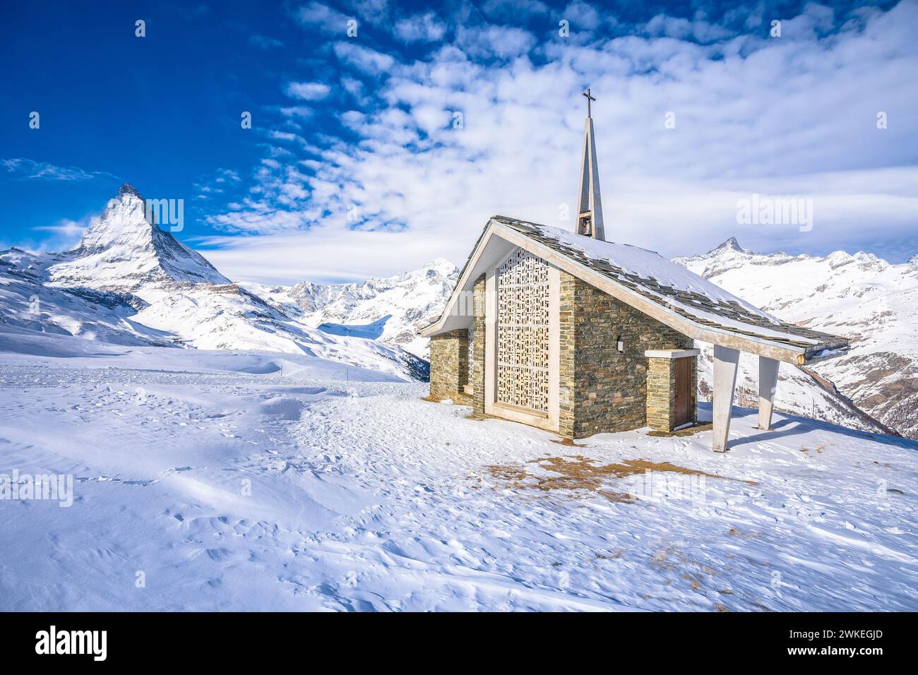 Riffelberg chapel under Matterhorn mountain peak scenic winter ...