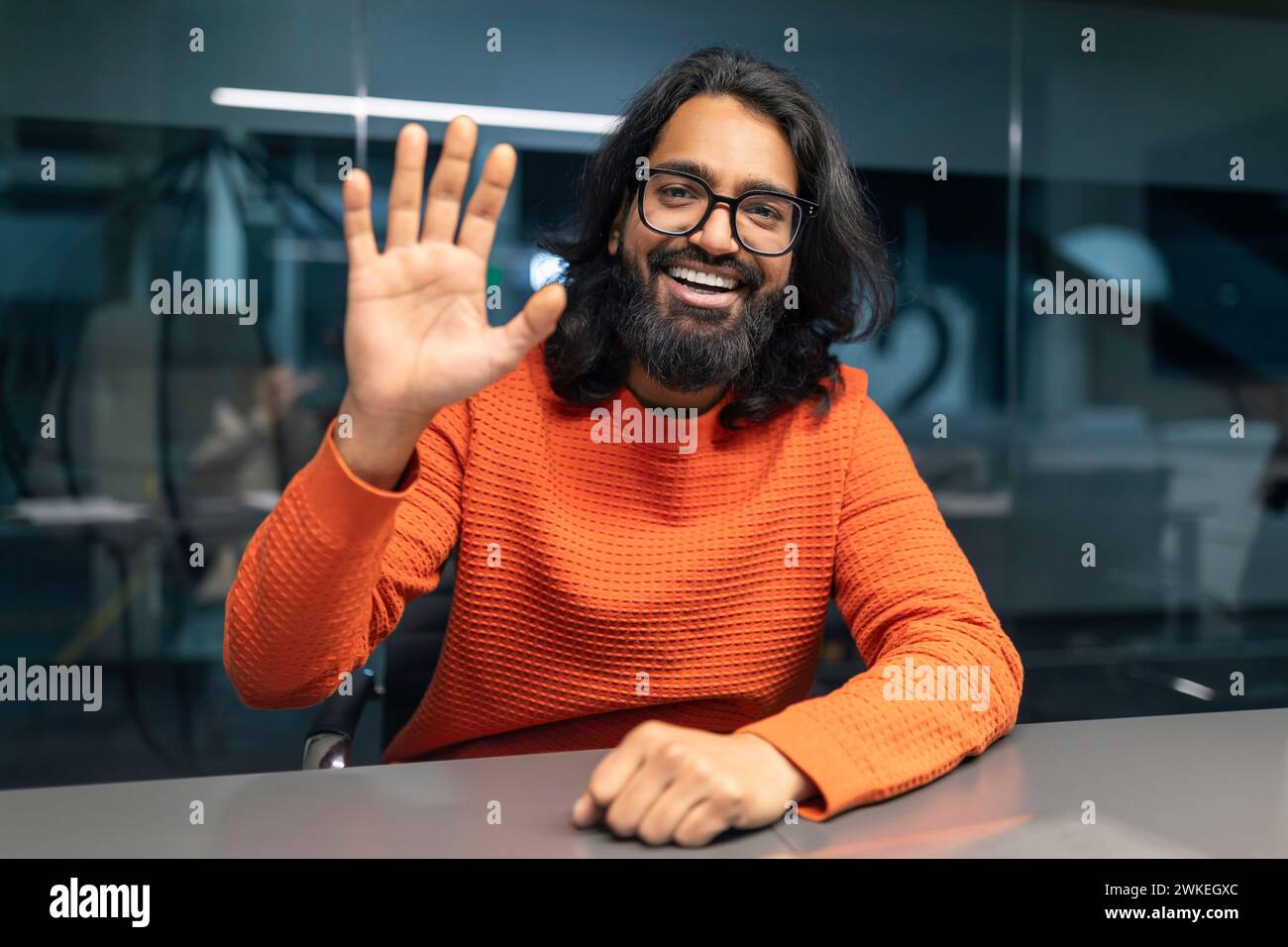 Hello welcoming young man waving hi-res stock photography and images ...