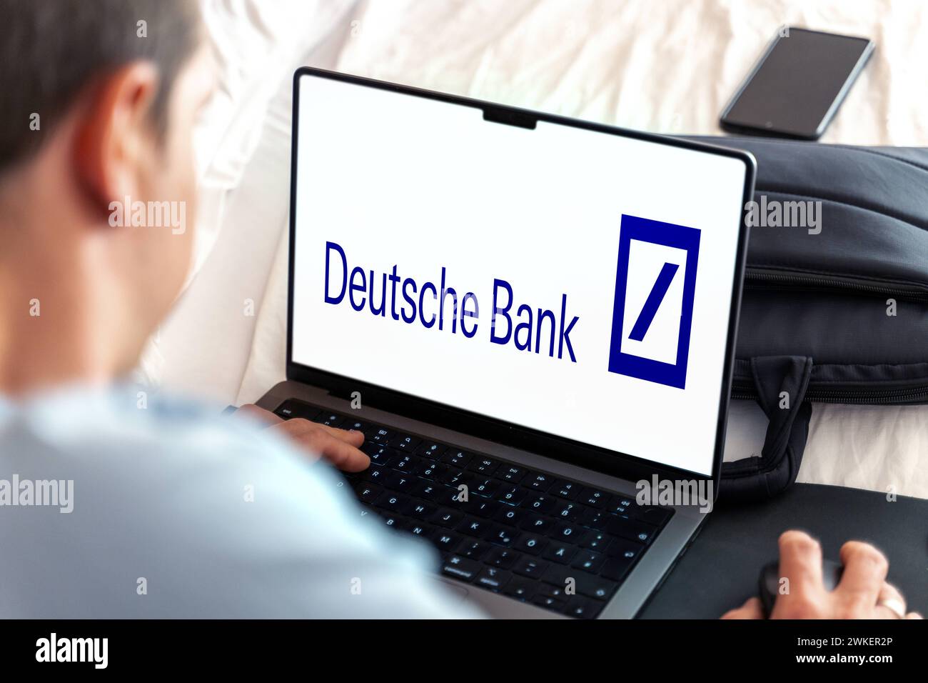 February 20, 2024: Man sitting at a laptop computer, the DEUTSCHE BANK ...