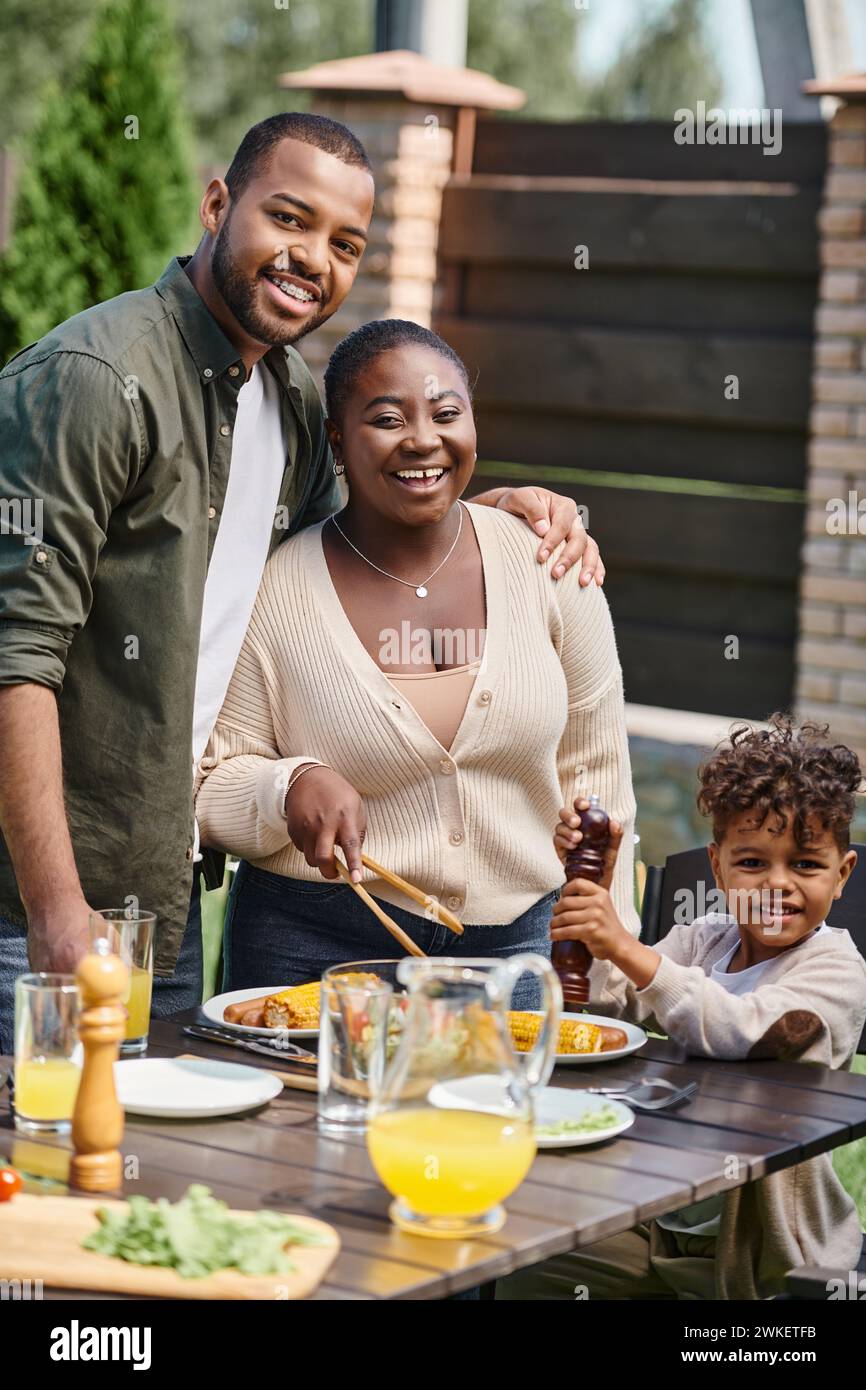 portrait of happy african american parents and son preparing garden ...