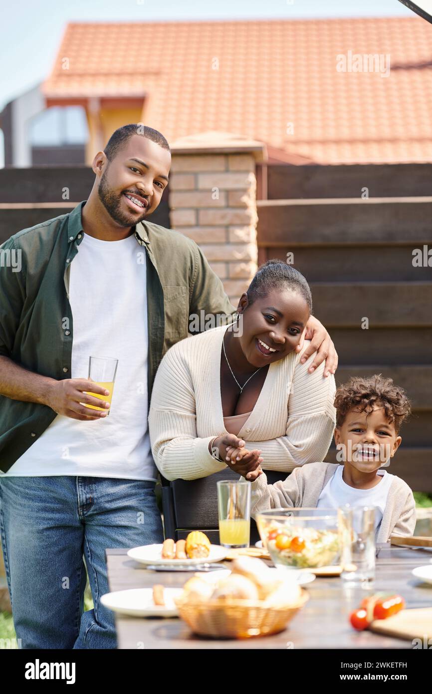 portrait of happy african american parents and son preparing garden ...