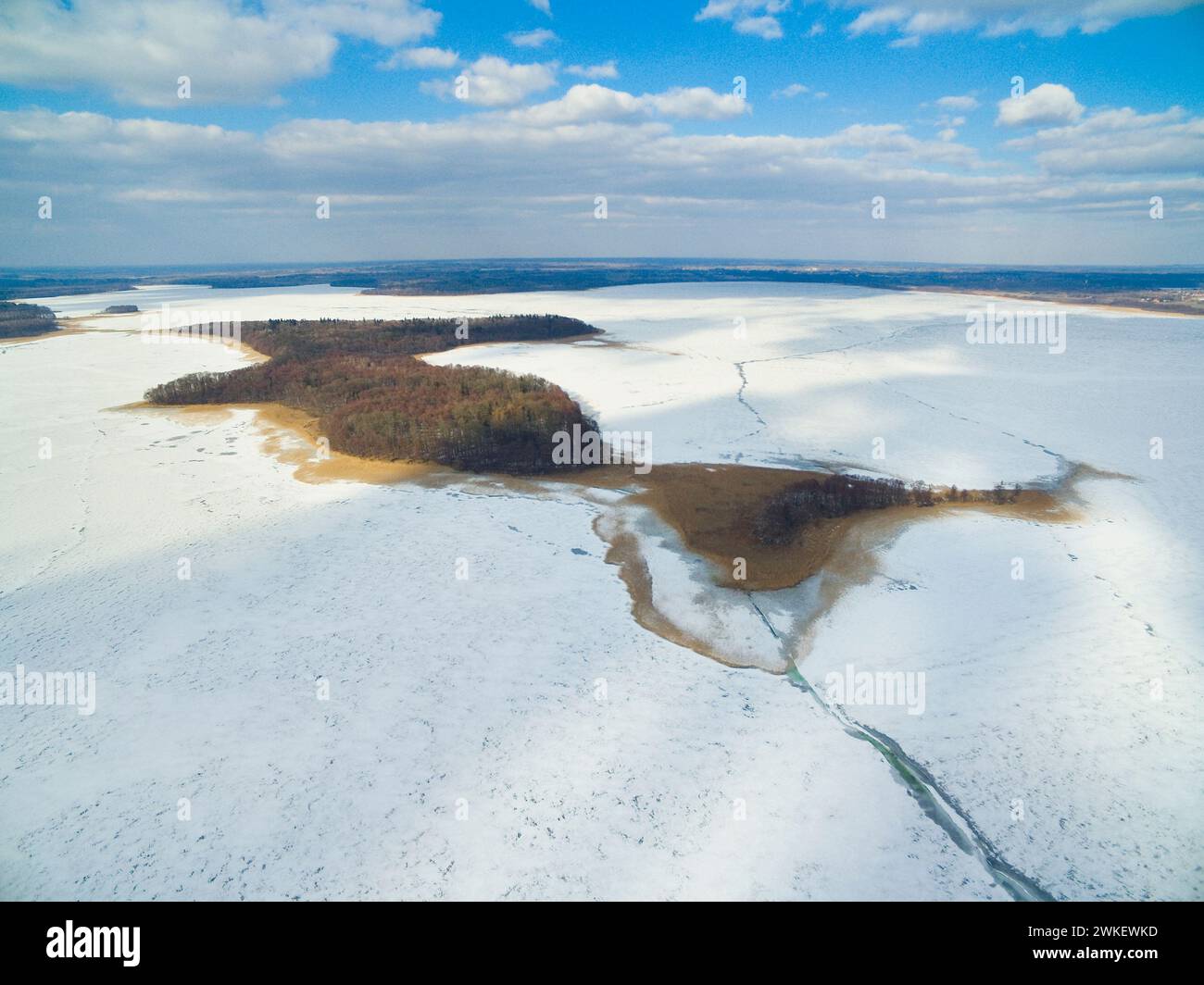 Upalty island on the frozen Mamry lake, Mazury, Poland Stock Photo - Alamy