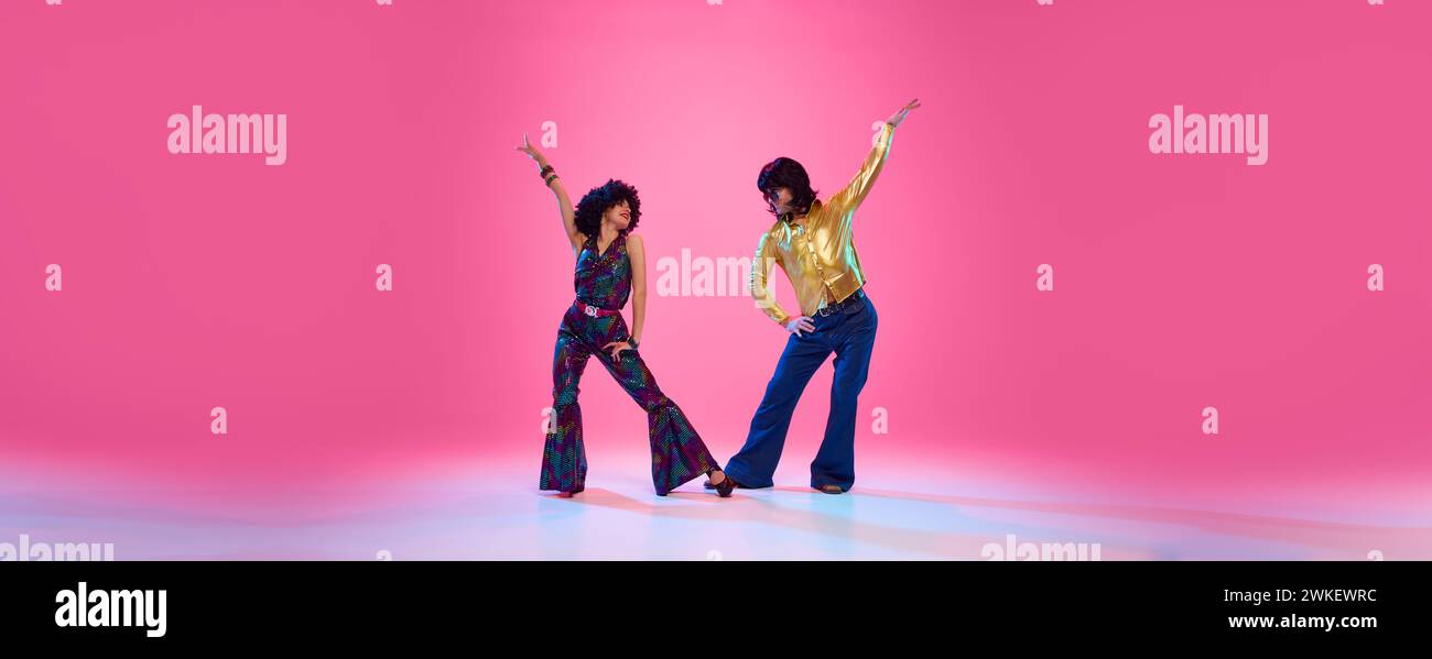Banner. Two people wearing in flamboyant disco outfit posing in ...