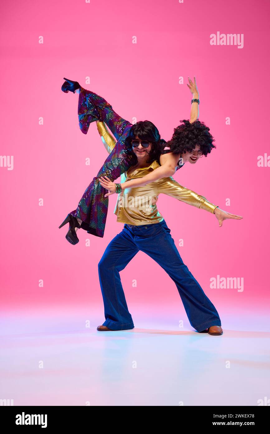 To rhythm of dance. Talented couple, dance partners in dynamic disco ...