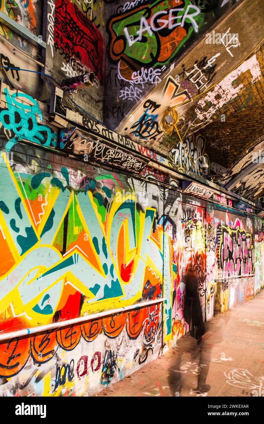 CCTV camera covered in graffiti and surrounded by street artwork in the ...