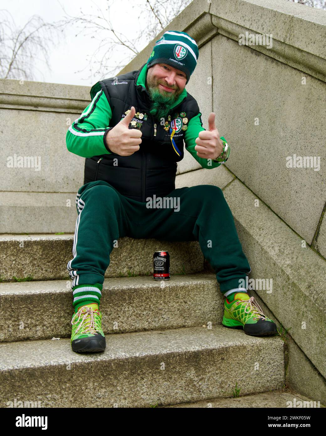 Irish rugby fan resting up on the steps,before going into the stadium ...