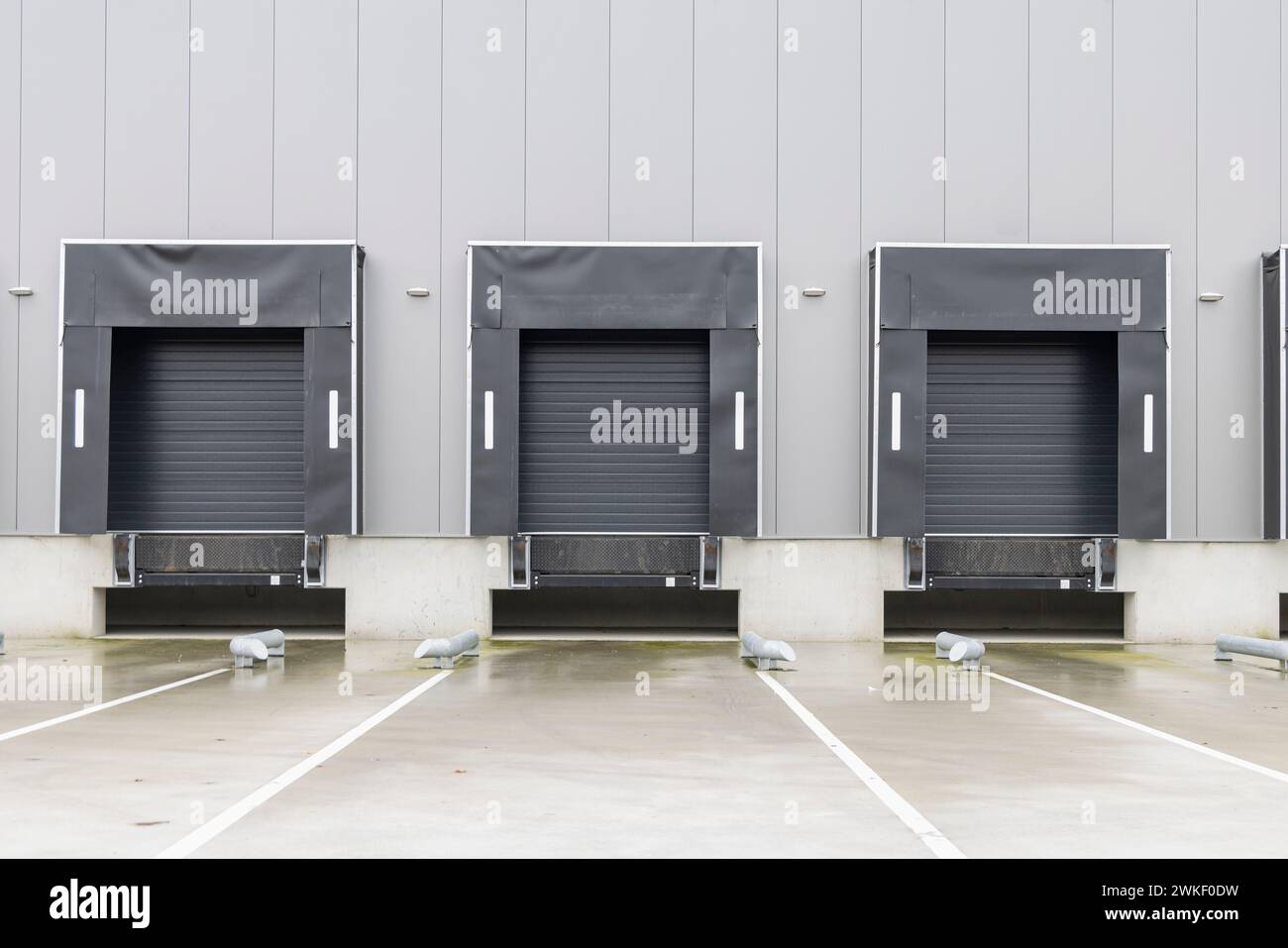 Row of gray loading docks of a warehouse or distbution center Stock ...